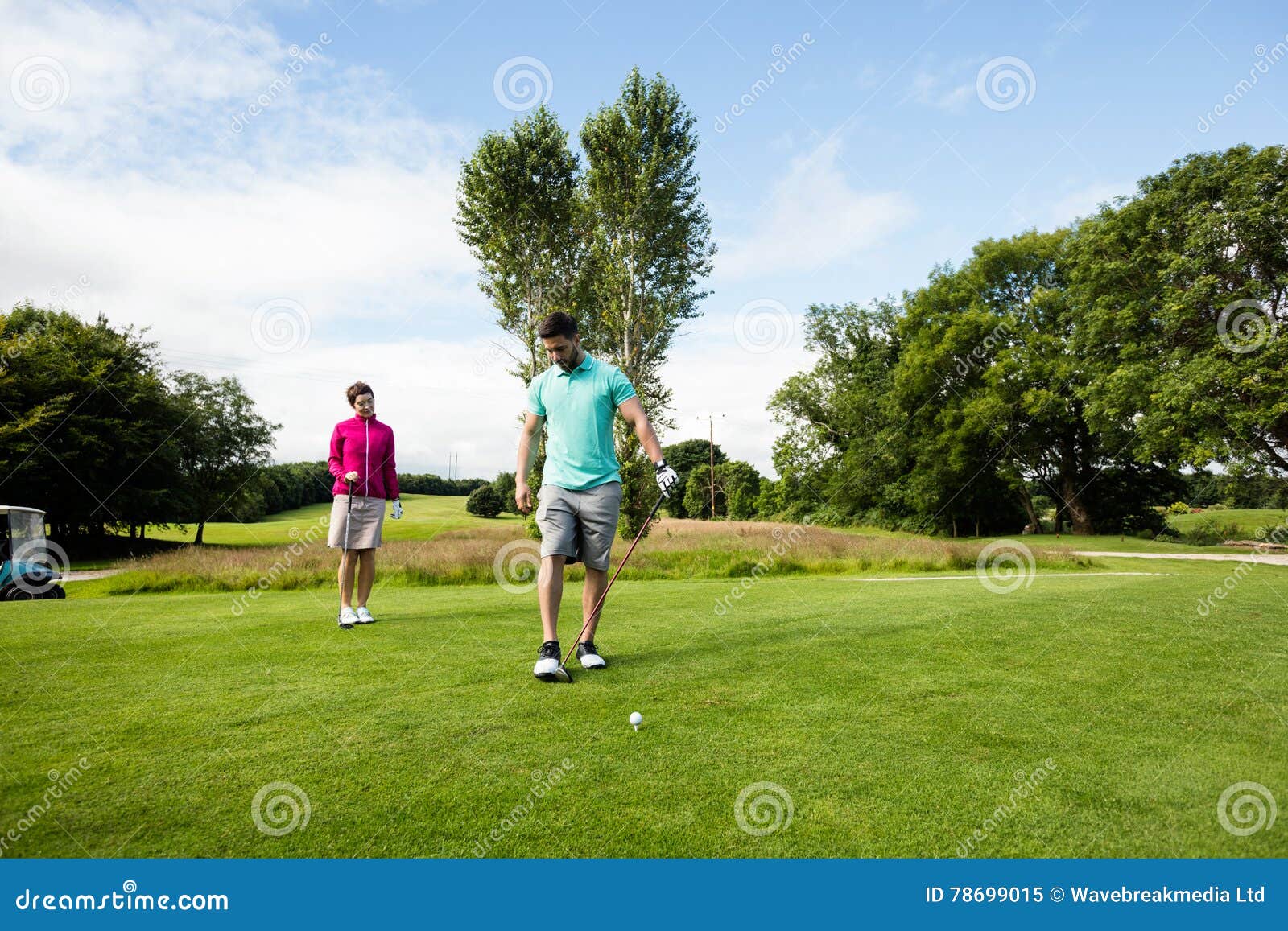 Male Instructor Assisting Woman in Learning Golf Stock Image - Image of ...