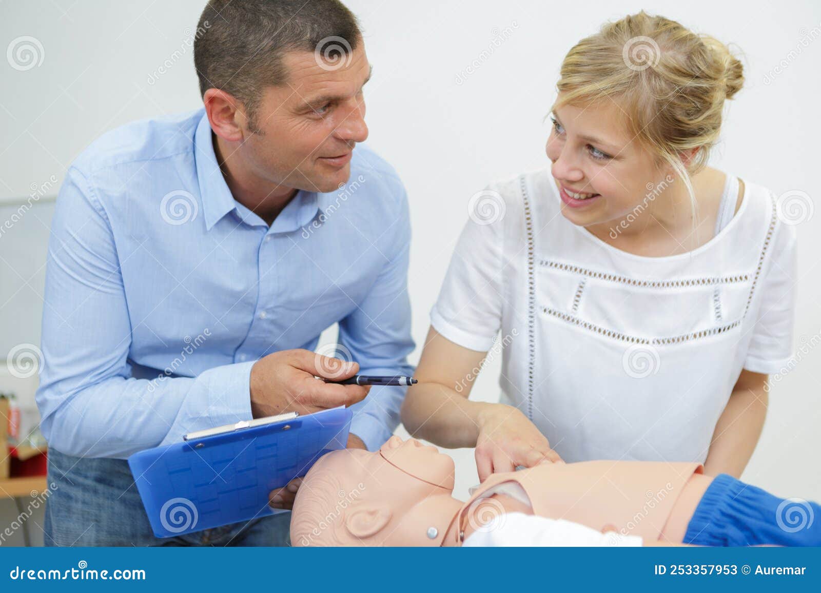 Male Instructor Explaining Cpr To Student Using Dummy Stock Image ...