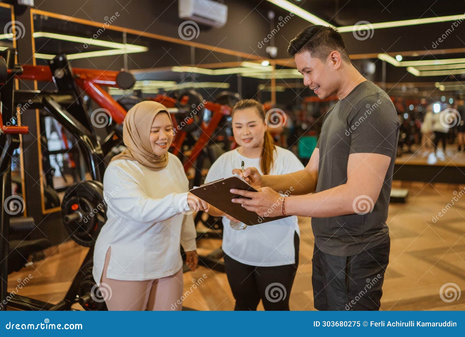 Male Instructor Explaining Trainee Workout Plan Stock Image - Image of ...