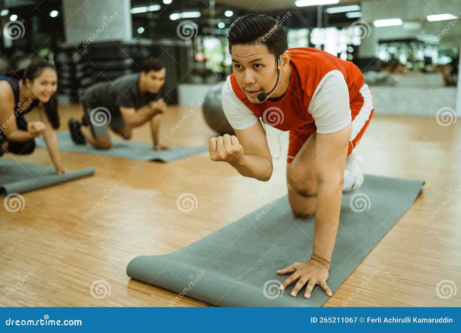 Male Instructor Giving Examples of Movements To Train the Abdominal ...