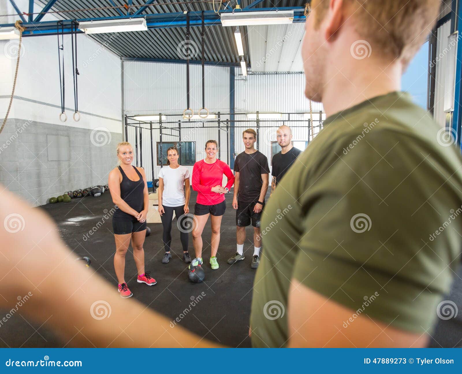 Male Instructor Training Athletes at Gym Stock Image - Image of male ...