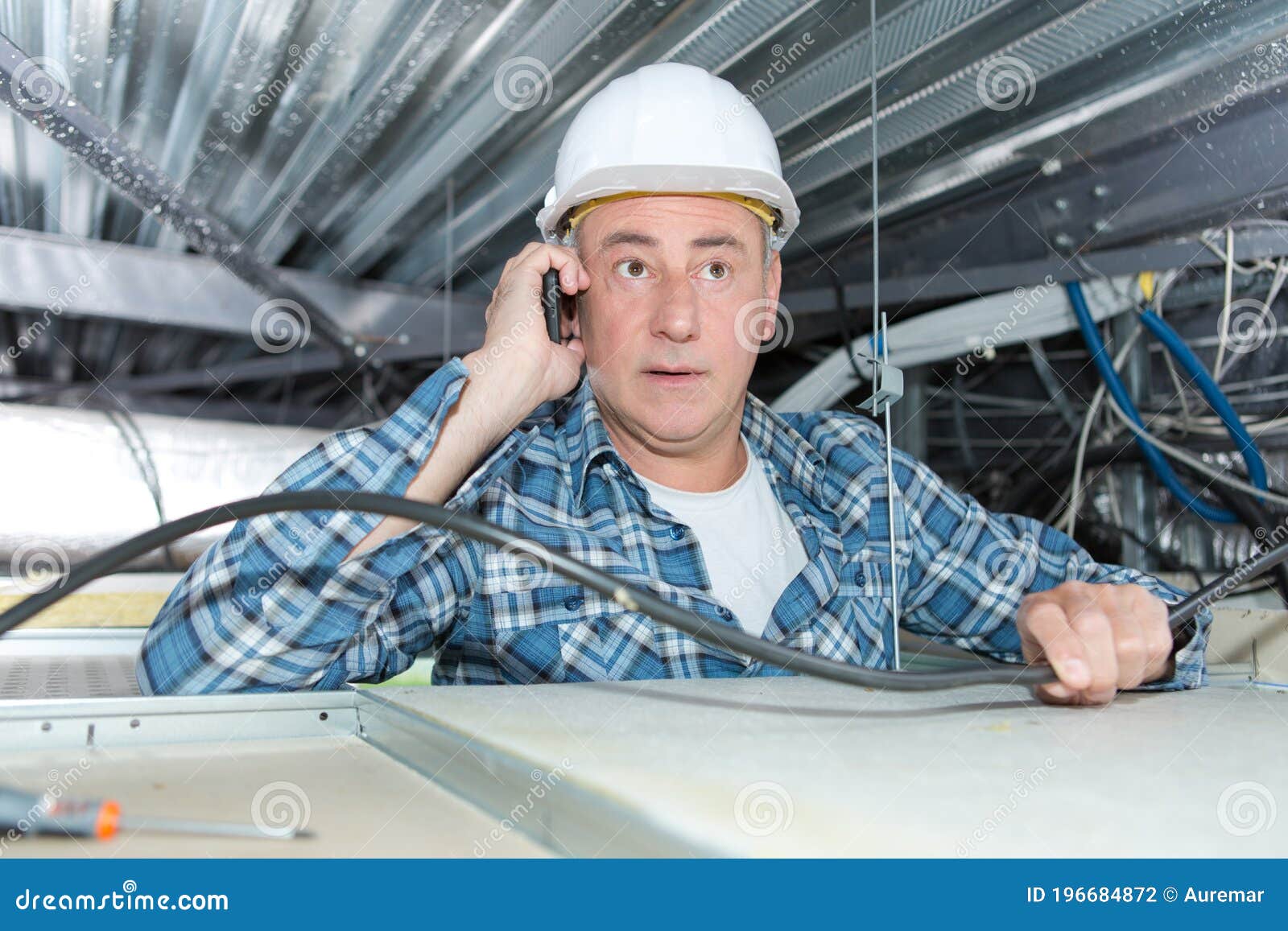 Male Insulation Installer on Phone Stock Photo - Image of roofing, ring ...