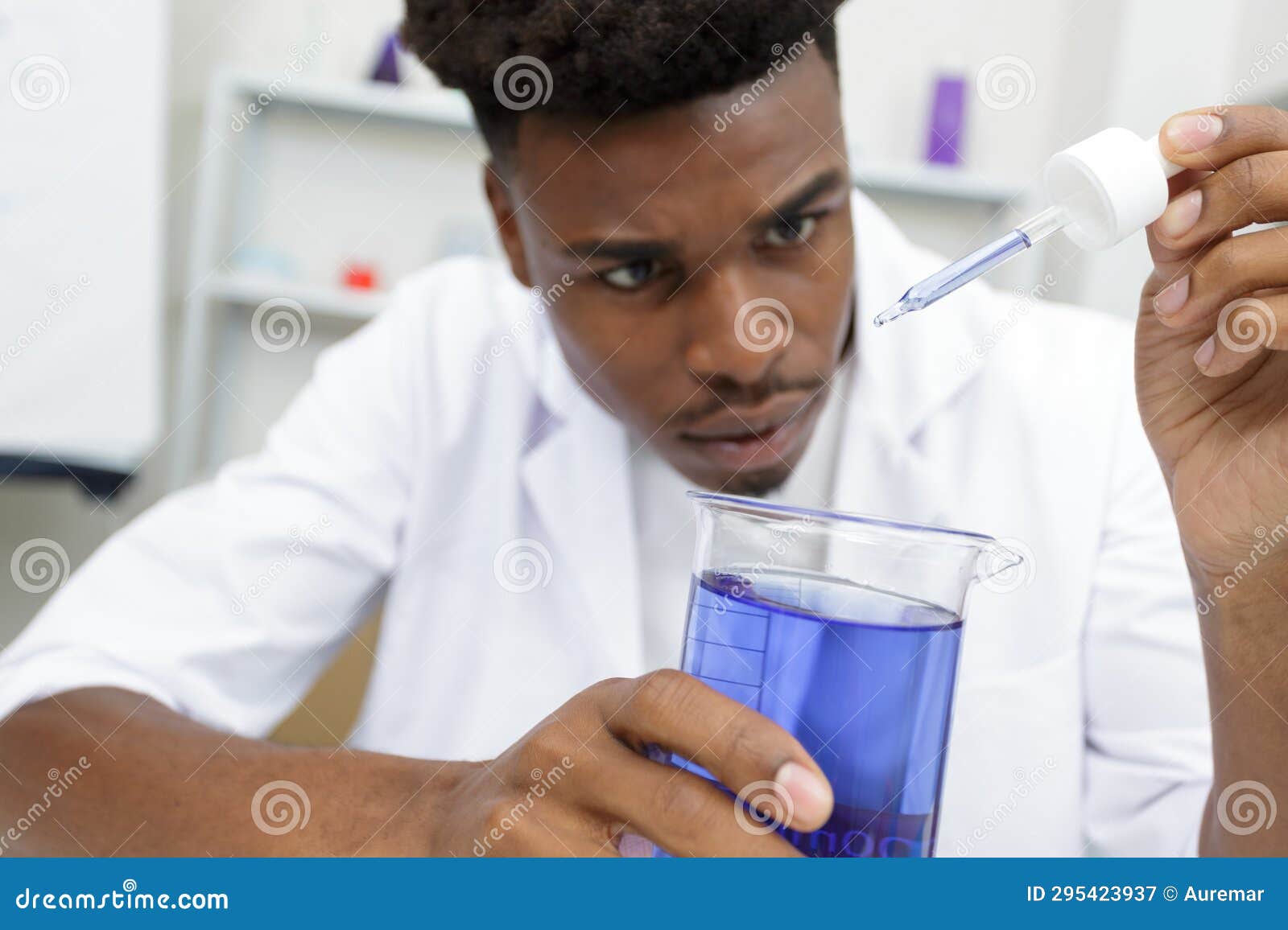 Male Lab Assistant Studying Blood Sample for Analysis Stock Image ...