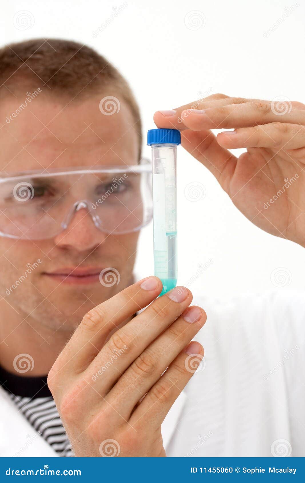 Male Lab Technician Looking at Test Tube Stock Photo - Image of ...
