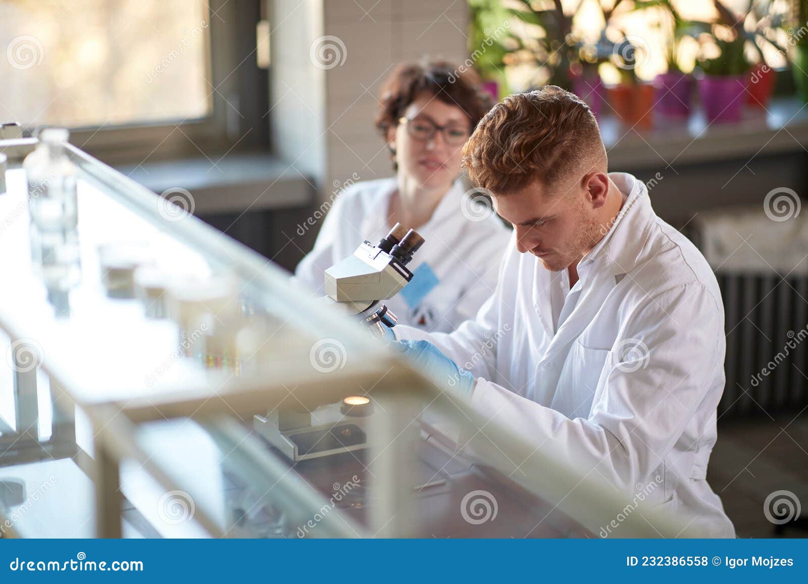 Male in Lab Working with Microscope Stock Photo - Image of colorful ...