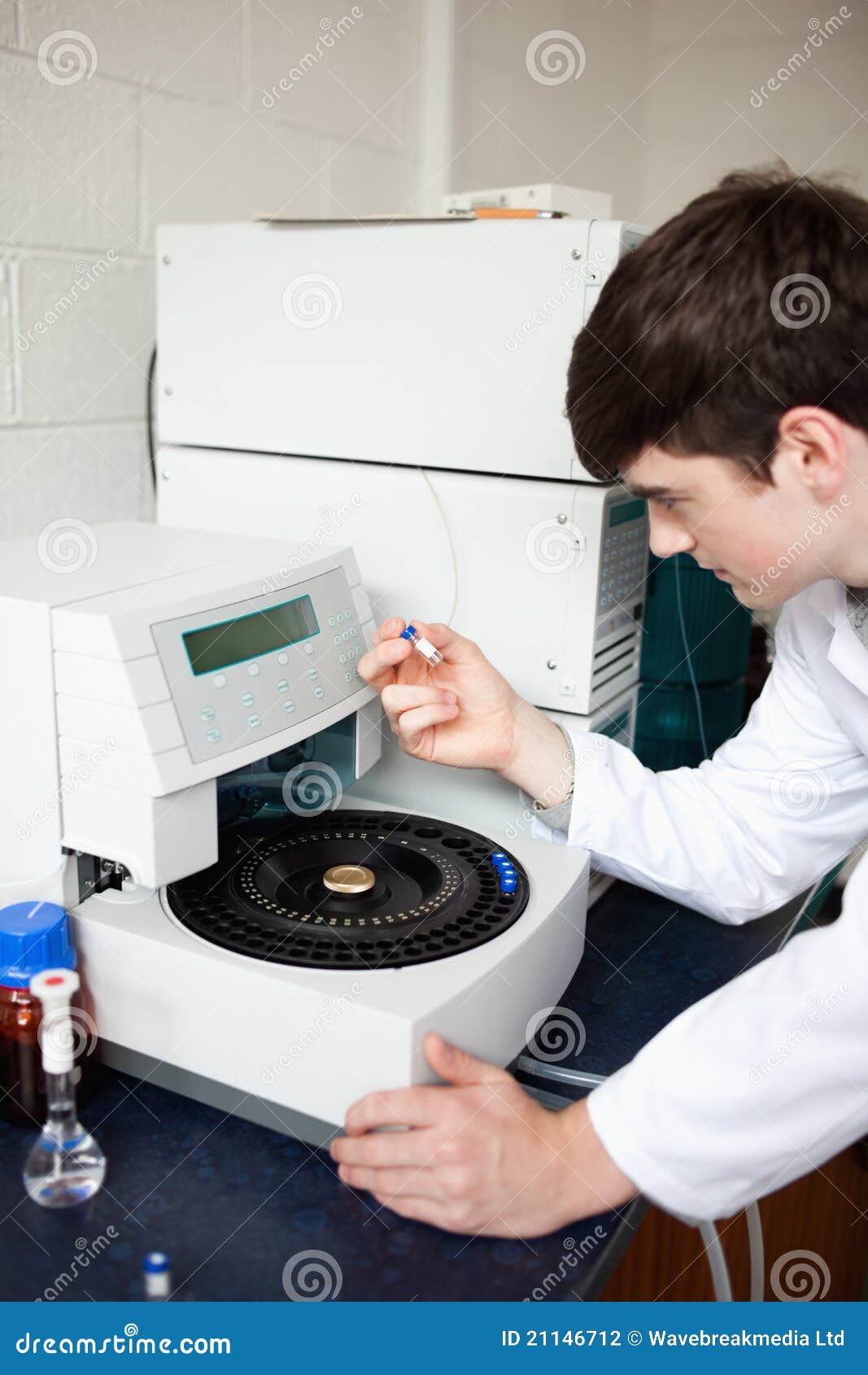 Male Laboratory Assistant Using a Centrifuge Stock Photo - Image of ...