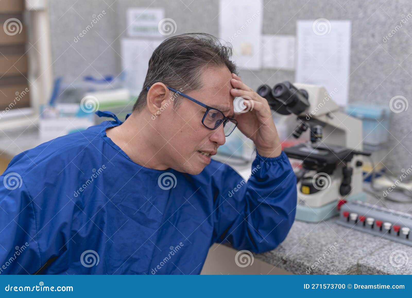 A Male Laboratory Technician or Microbiologist in His 40s Having ...