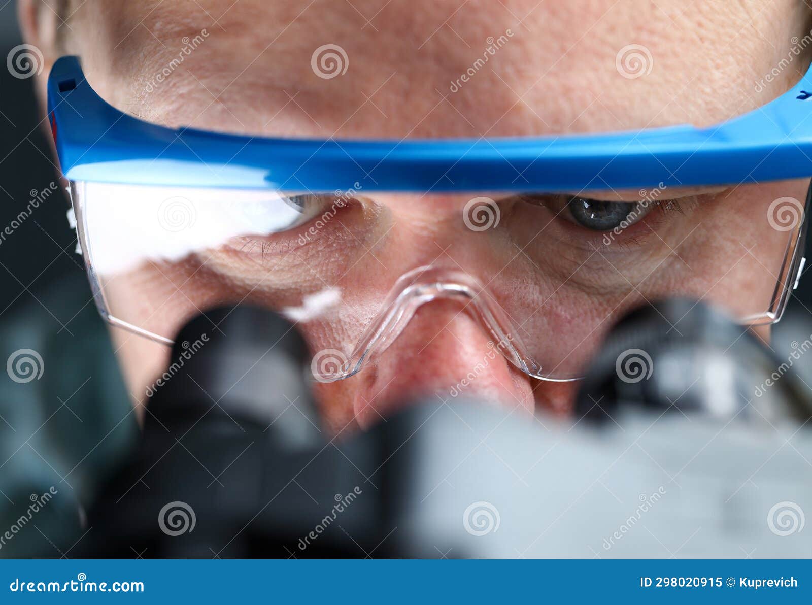 Male Laboratory Worker Eyes Looking at Microscope Wearing Goggles Stock ...