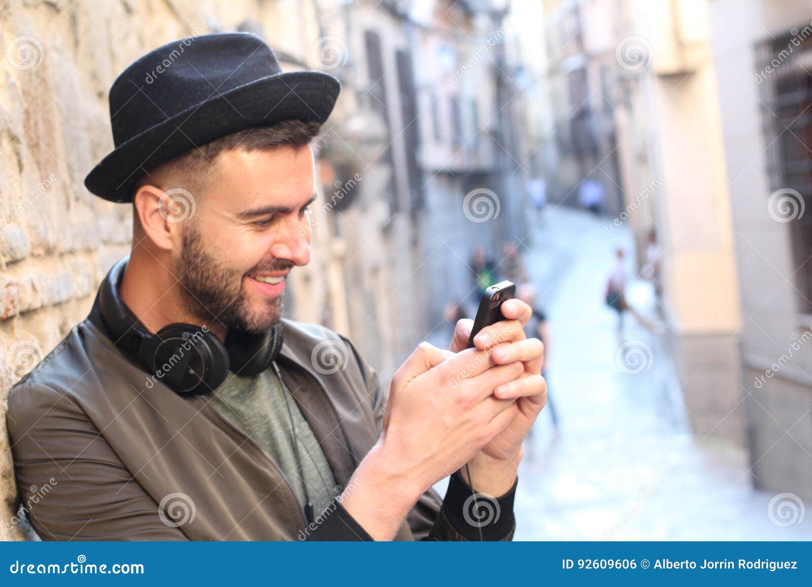 Male Laughing while Texting Outdoors Stock Photo - Image of hipster ...