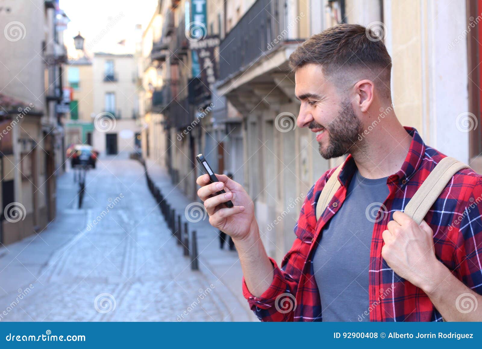 Male Laughing while Texting Outdoors with Copy Space Stock Photo ...