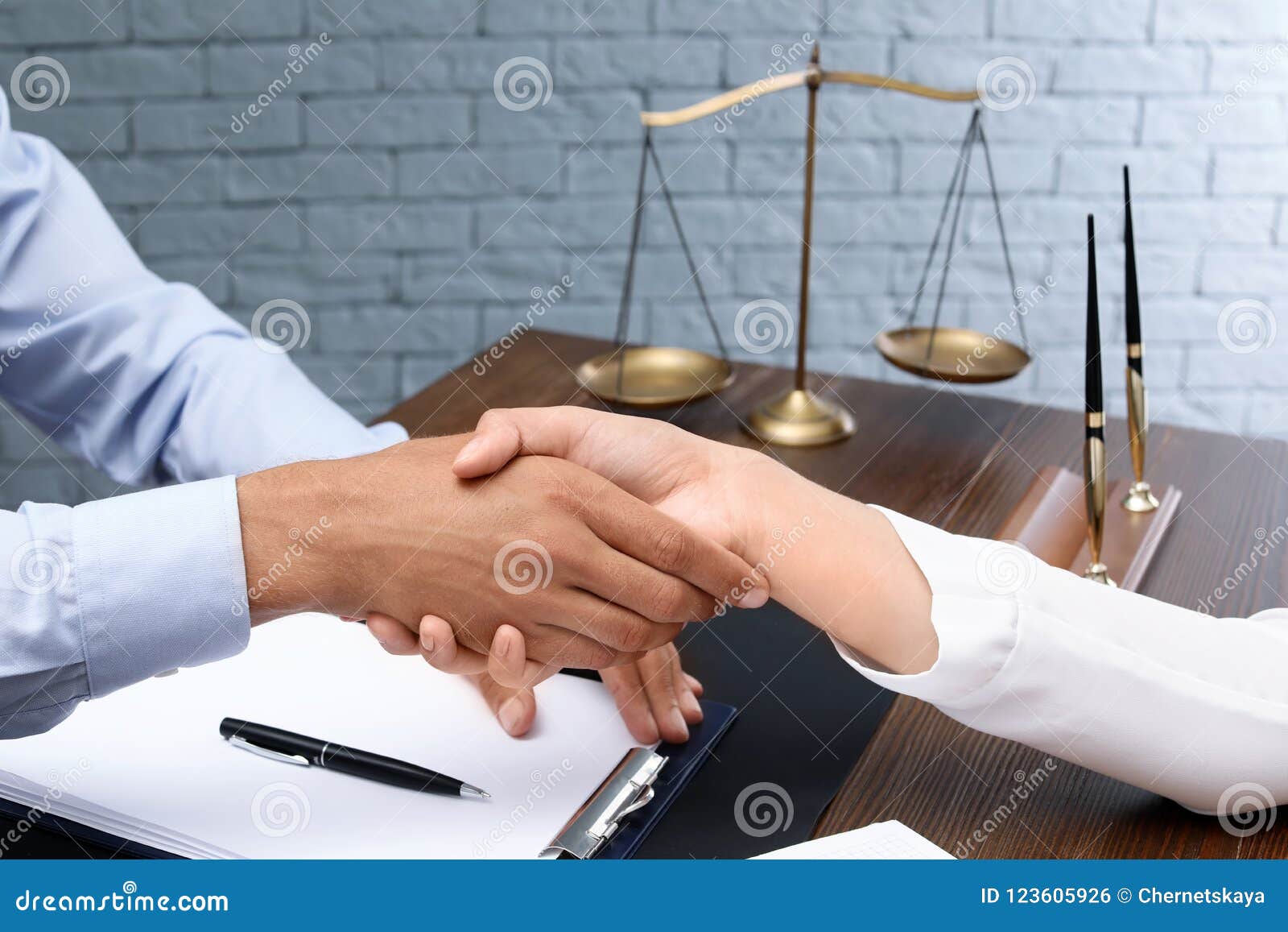 Male Lawyer Shaking Hands with Client at Table Stock Photo - Image of ...