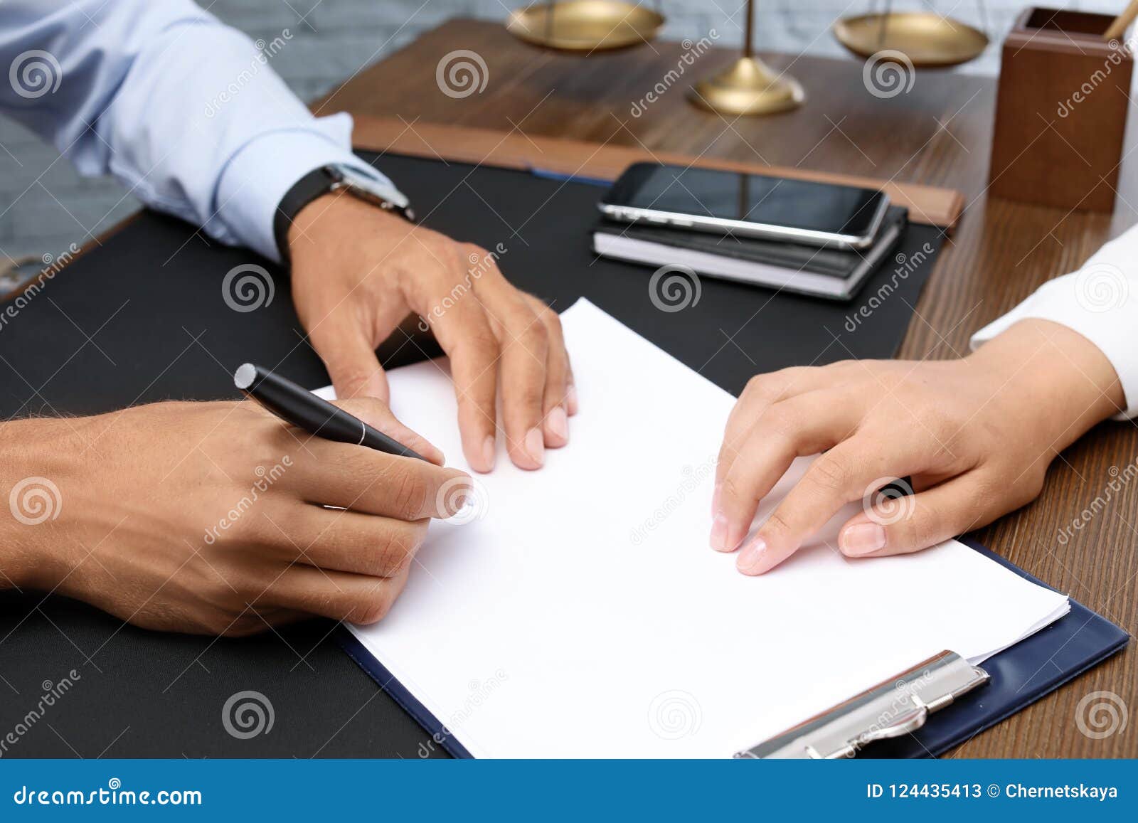 Male Lawyer Working with Client at Table Stock Image - Image of ...