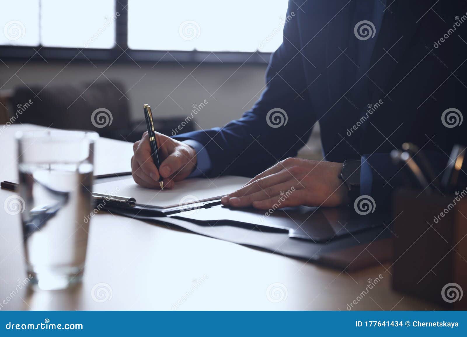 Male Lawyer Working at Table in Office Stock Photo - Image of ...