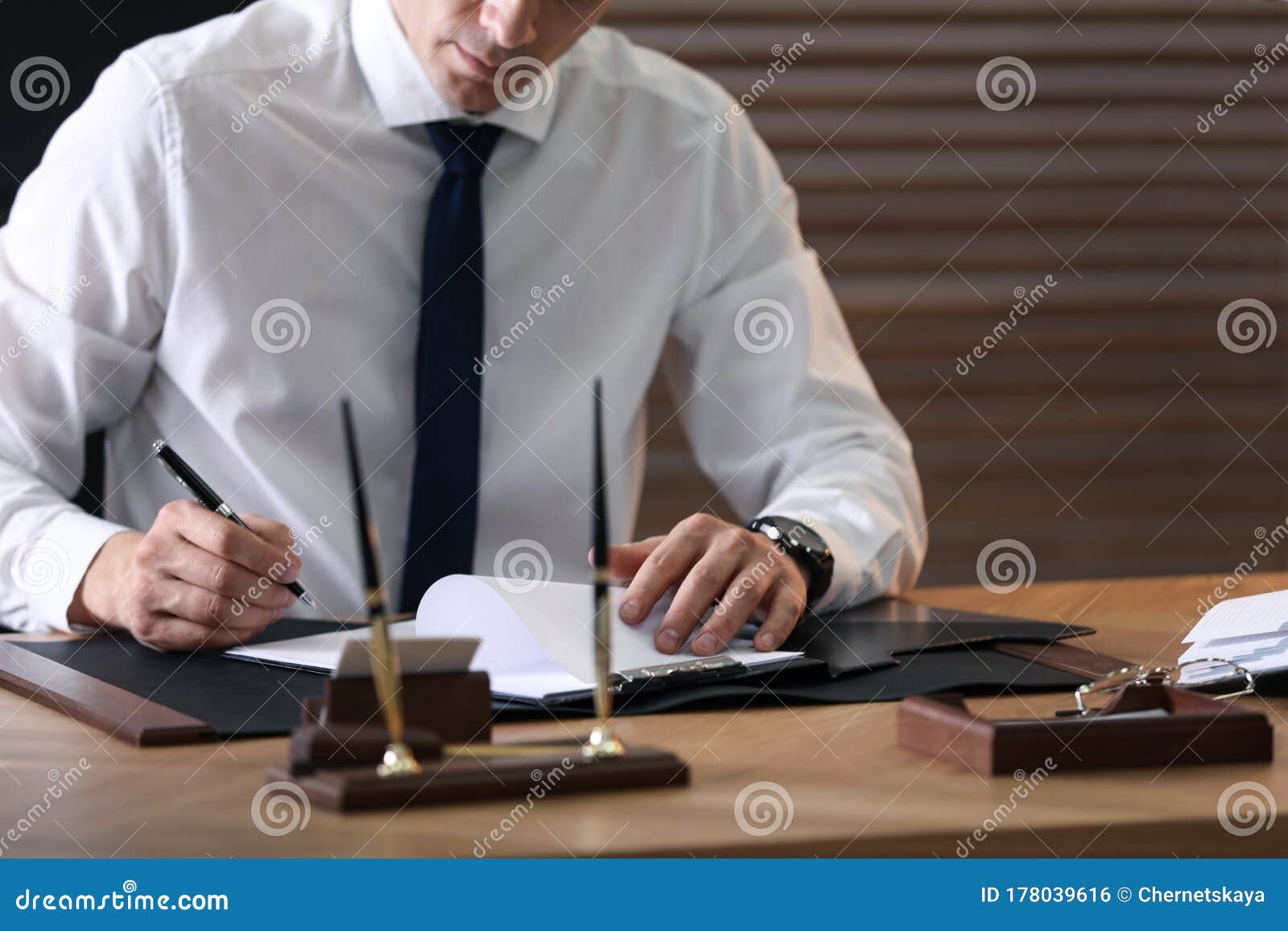 Male Lawyer Working at Table in Office Stock Photo - Image of contract ...