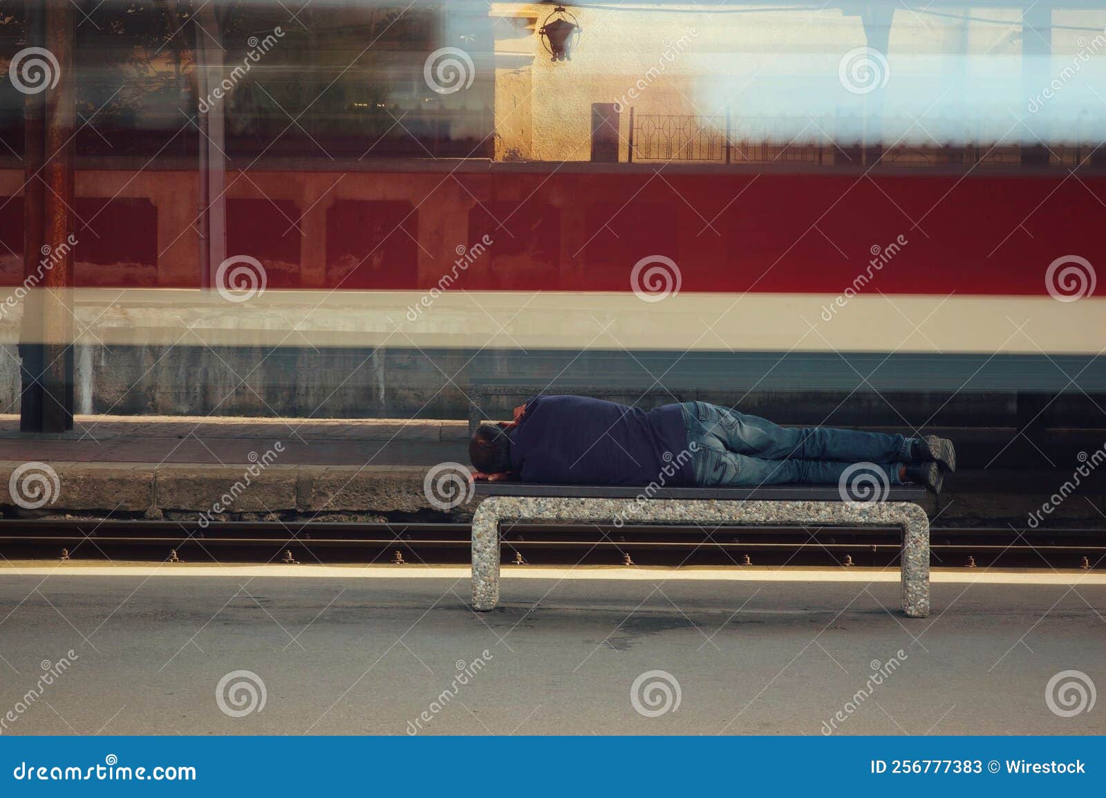 Male Laying and Resting on the Floor of a Train Station Stock Image ...