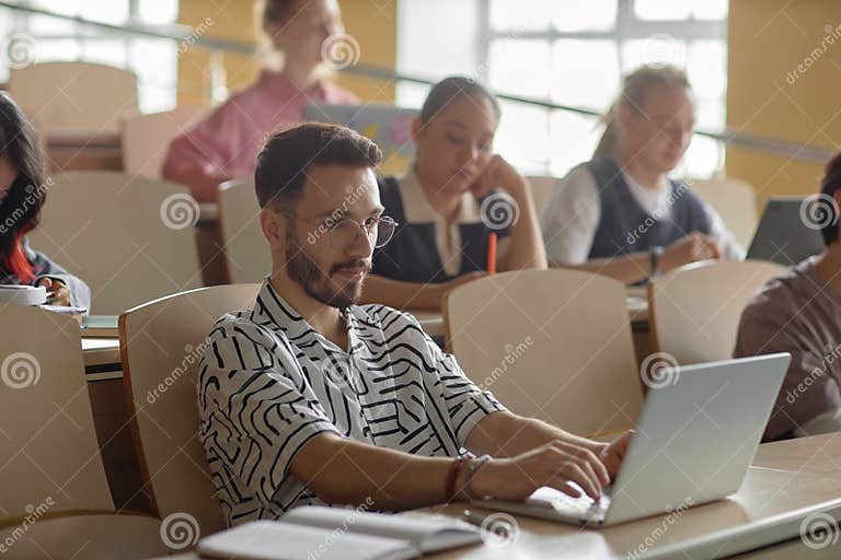 Male Learner Writing Lecture on Computer at College Stock Photo - Image ...