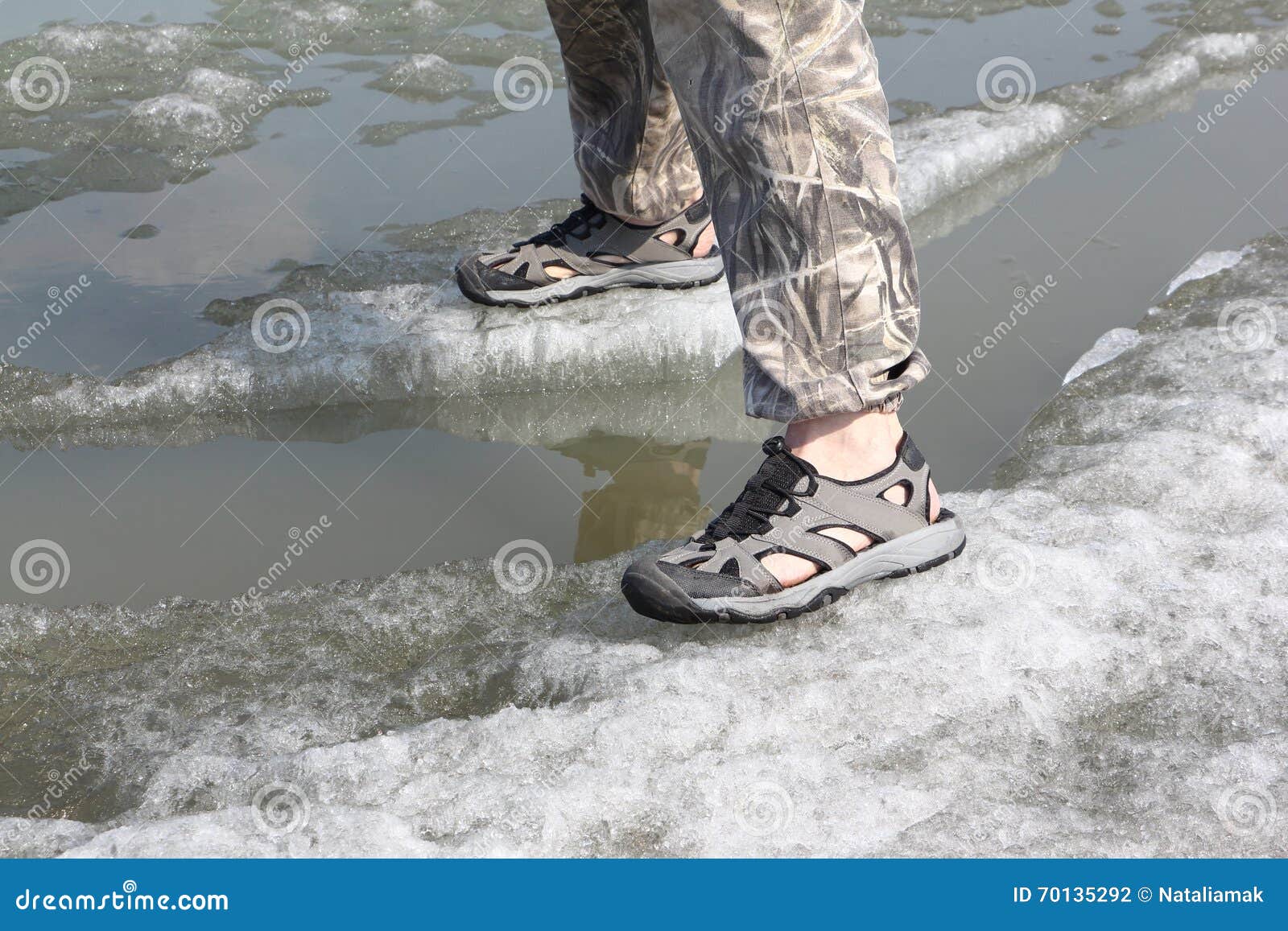 Male Legs in Sandals for Rafting on Ice of the River Stock Photo ...