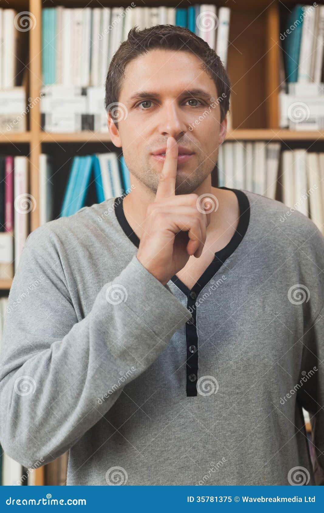 Male Librarian Making a Sign To Be Quiet in Library Stock Image - Image ...