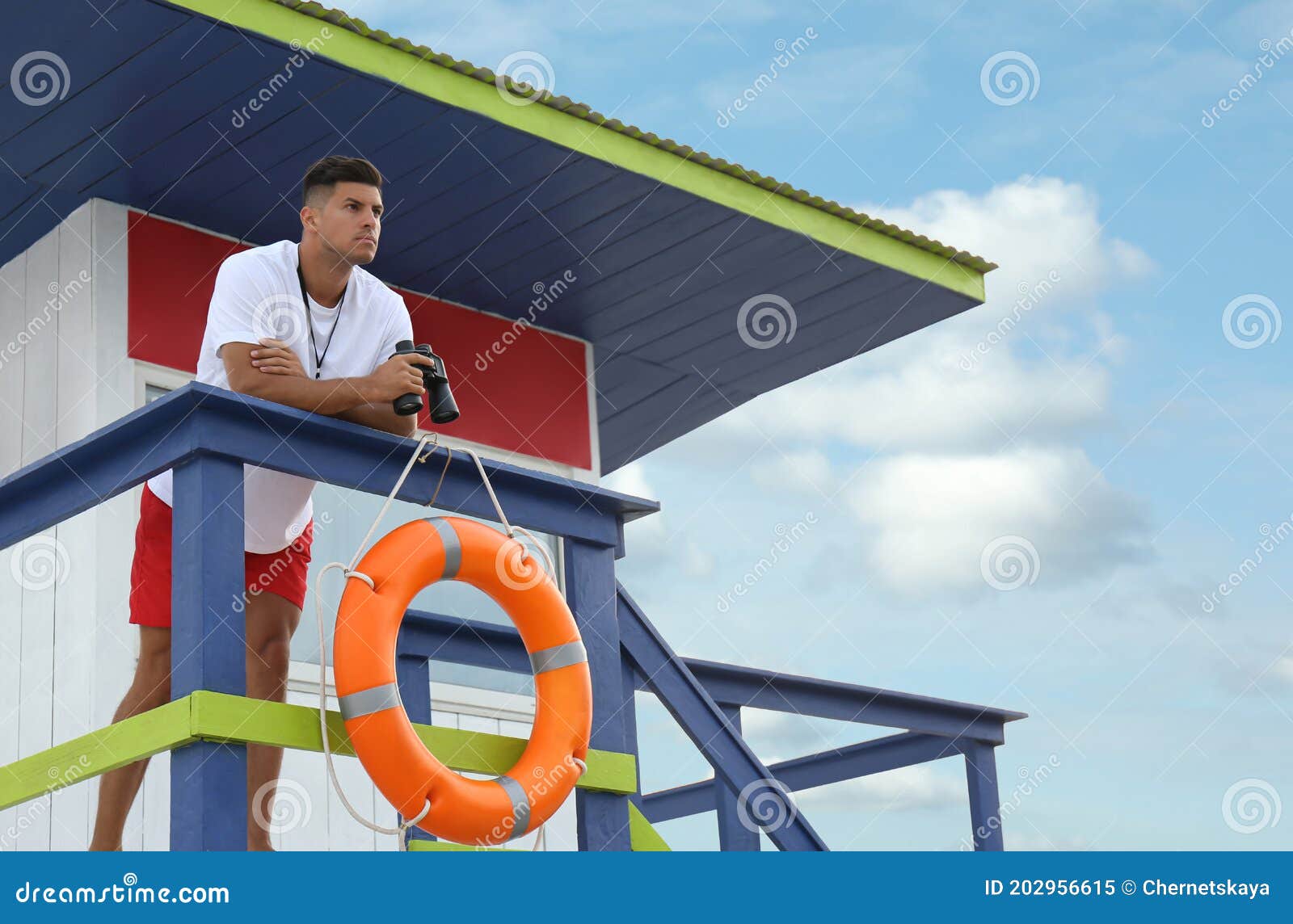 Male Lifeguard with Binocular on Watch Tower Stock Image - Image of ...