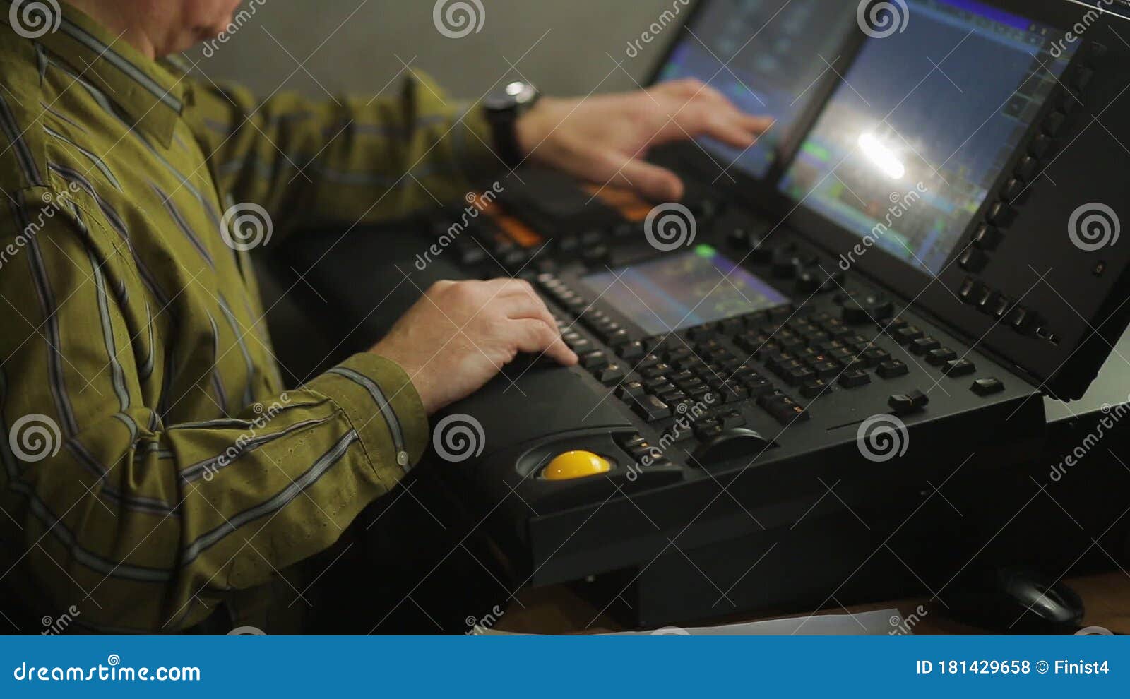 A Male Lighting Director at the Console Programs the Stage Light for ...