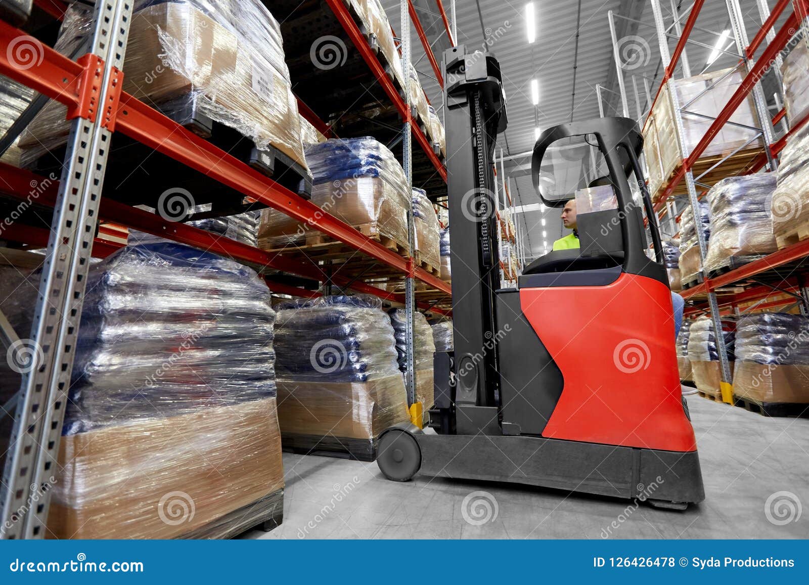 Male Loader Operating Forklift at Warehouse Stock Photo - Image of ...