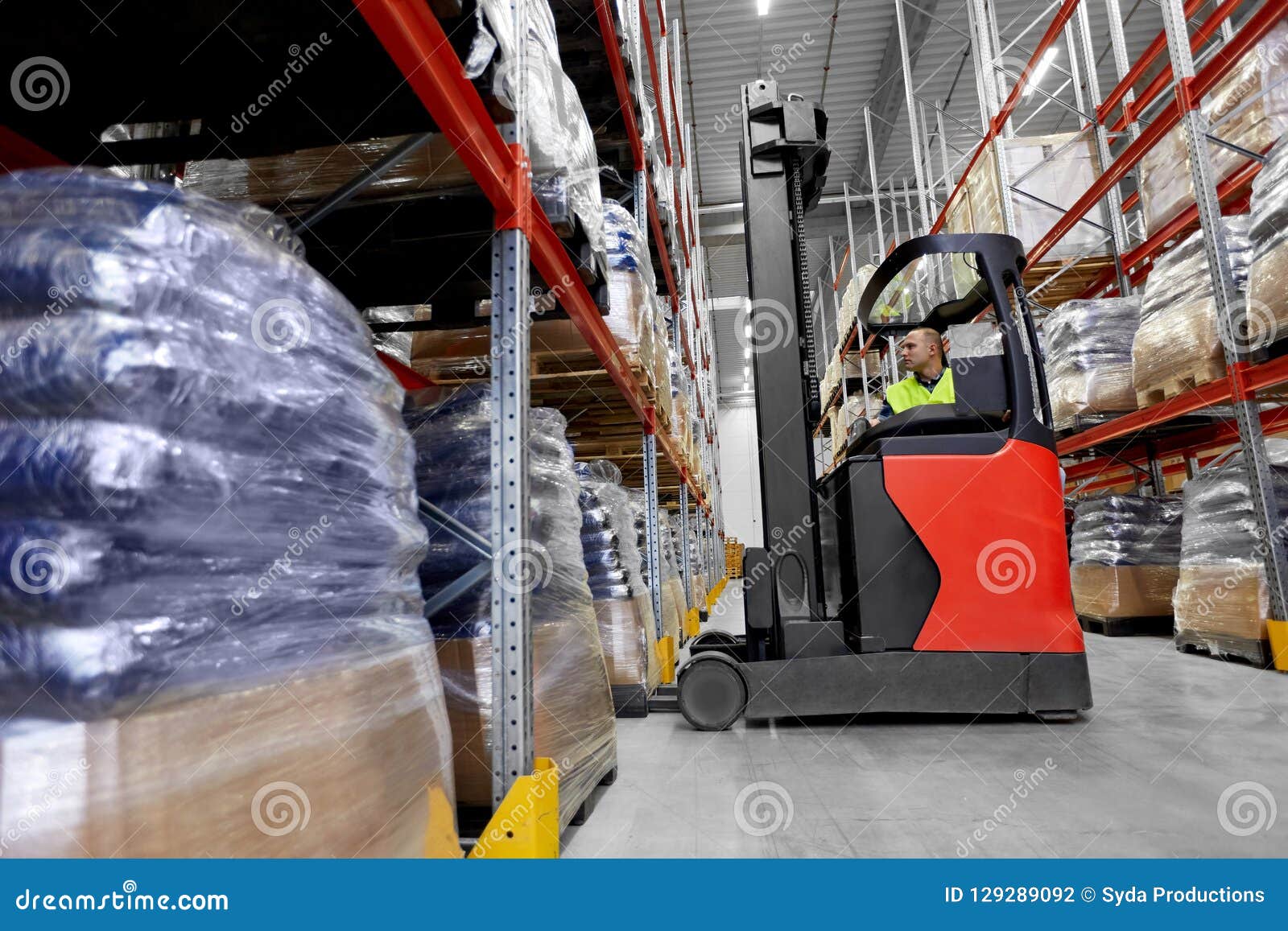 Male Loader Operating Forklift at Warehouse Stock Photo - Image of ...