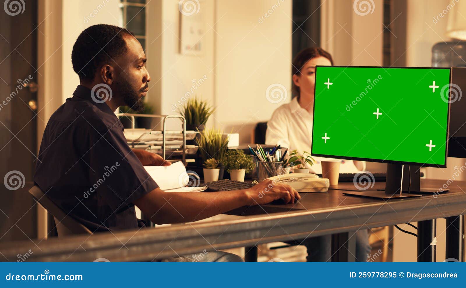 Male Manager Looking at Computer with Greenscreen Display Stock Image ...