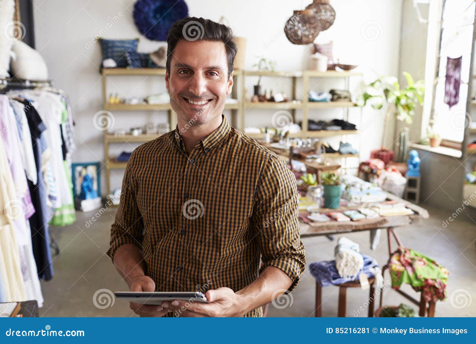 Male Manager with Tablet Computer Standing in Clothes Shop Stock Image ...