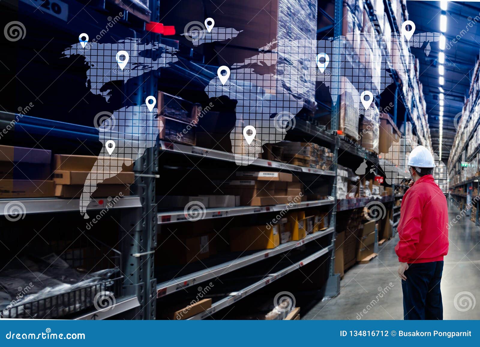 Male Manager Using Handheld in a Large Warehouse Worker Checking ...