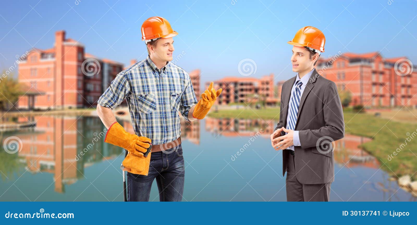 Manual Worker Having a Conversation with Architect, Buildings in Stock ...