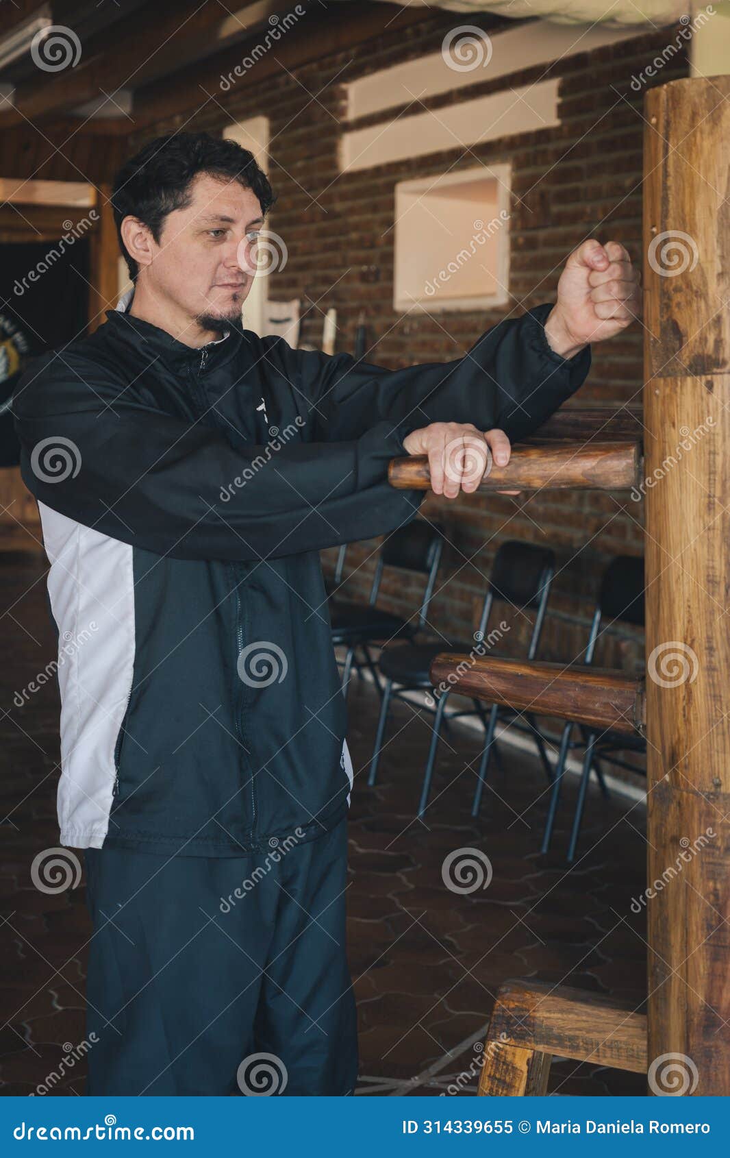 Man Training in Kung Fu Practice with a Wooden Dummy Stock Image ...