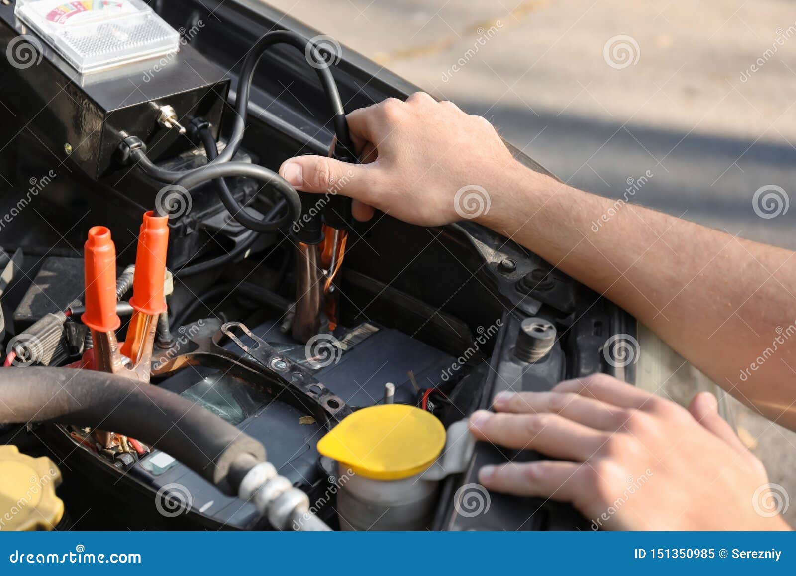 Male Mechanic Charging a Car Battery Stock Image - Image of battery ...