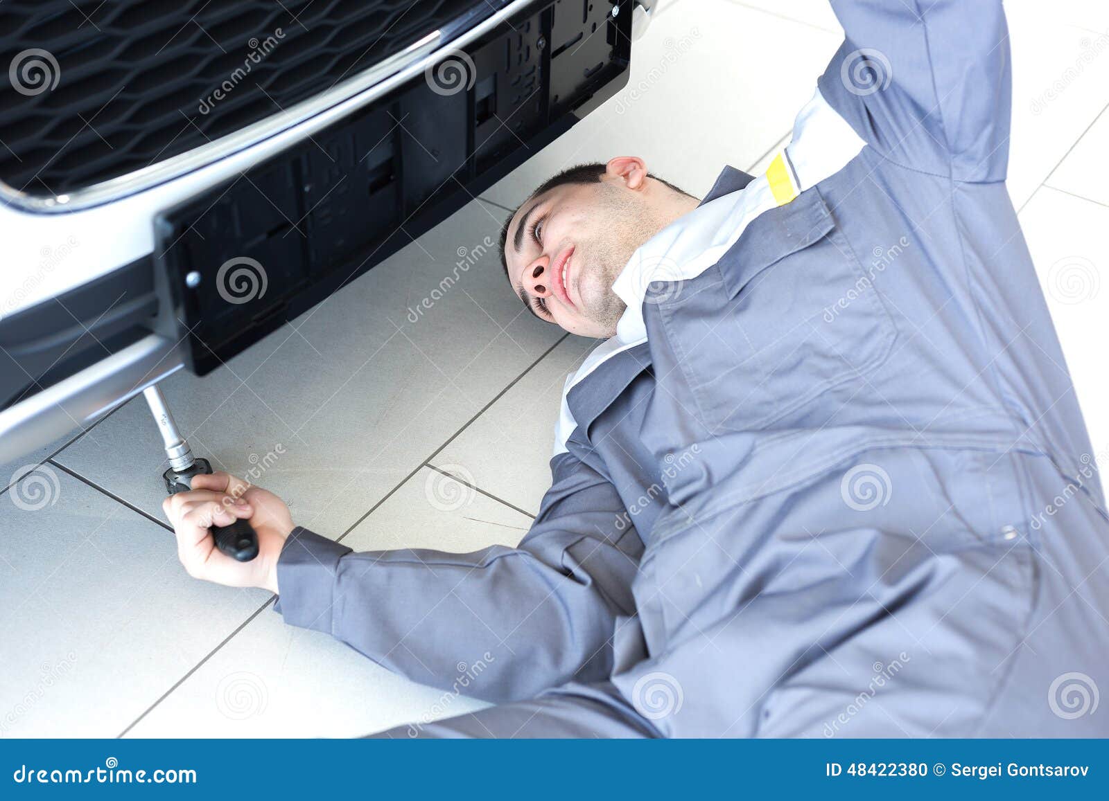 Male mechanic under car stock photo. Image of work, lying - 48422380