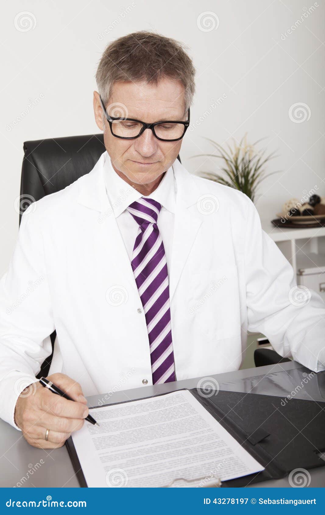 Male Medical Doctor Signing Document Stock Image - Image of paper ...