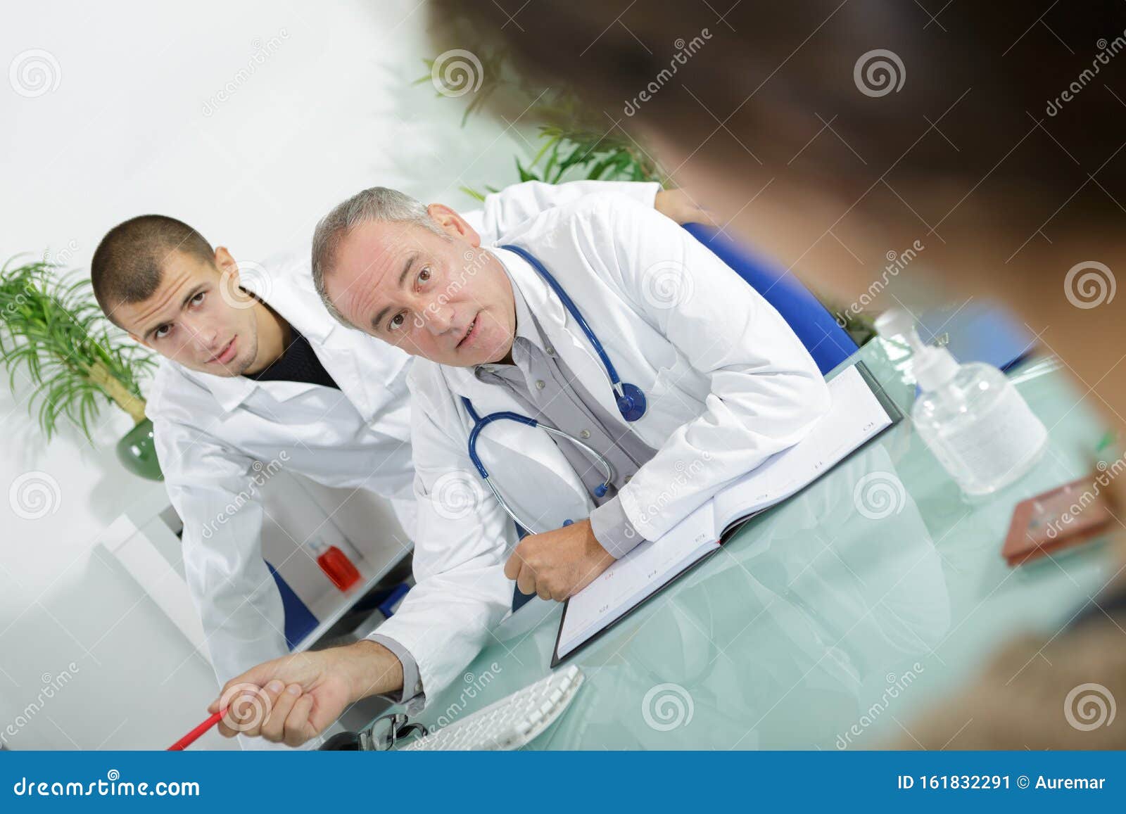 Male Medical Workers Waiting for Reply from Patient Stock Image - Image ...