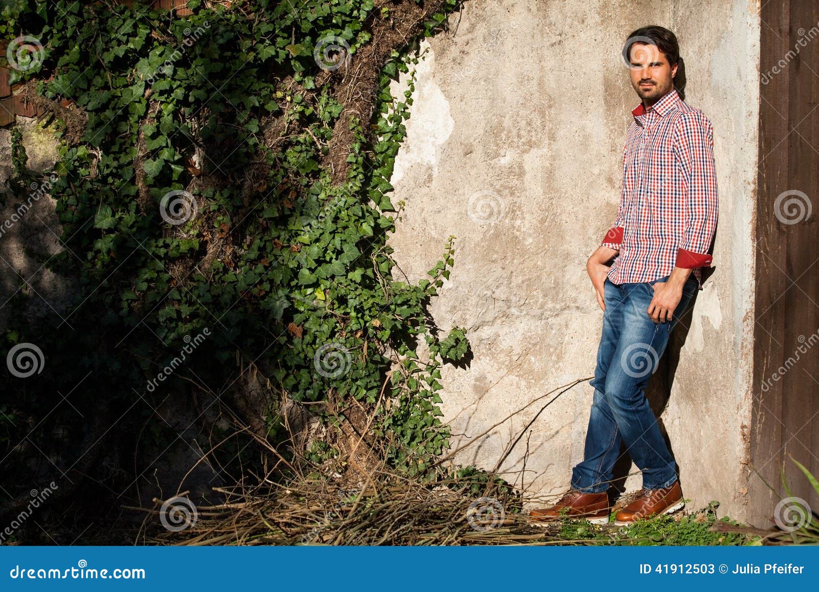 Male Model Leaning Against Wall Stock Image - Image of suave, male ...