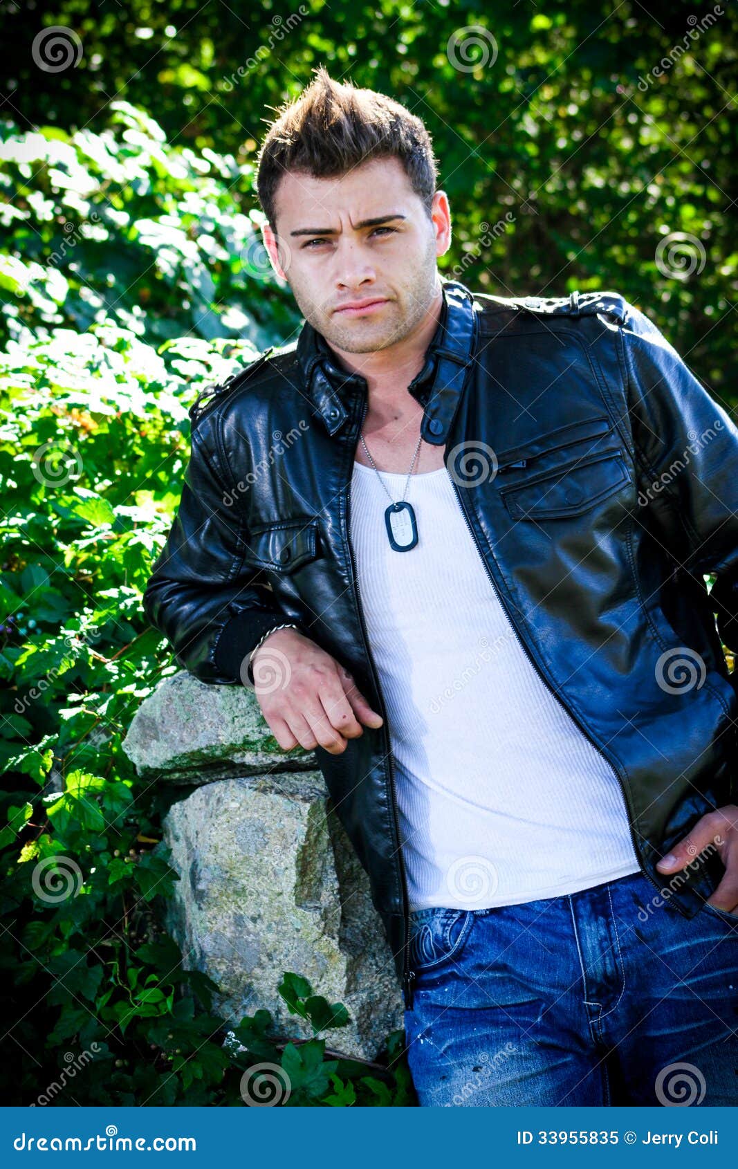 Male Model Leaning on a Stone Wall. Stock Image - Image of jacket ...