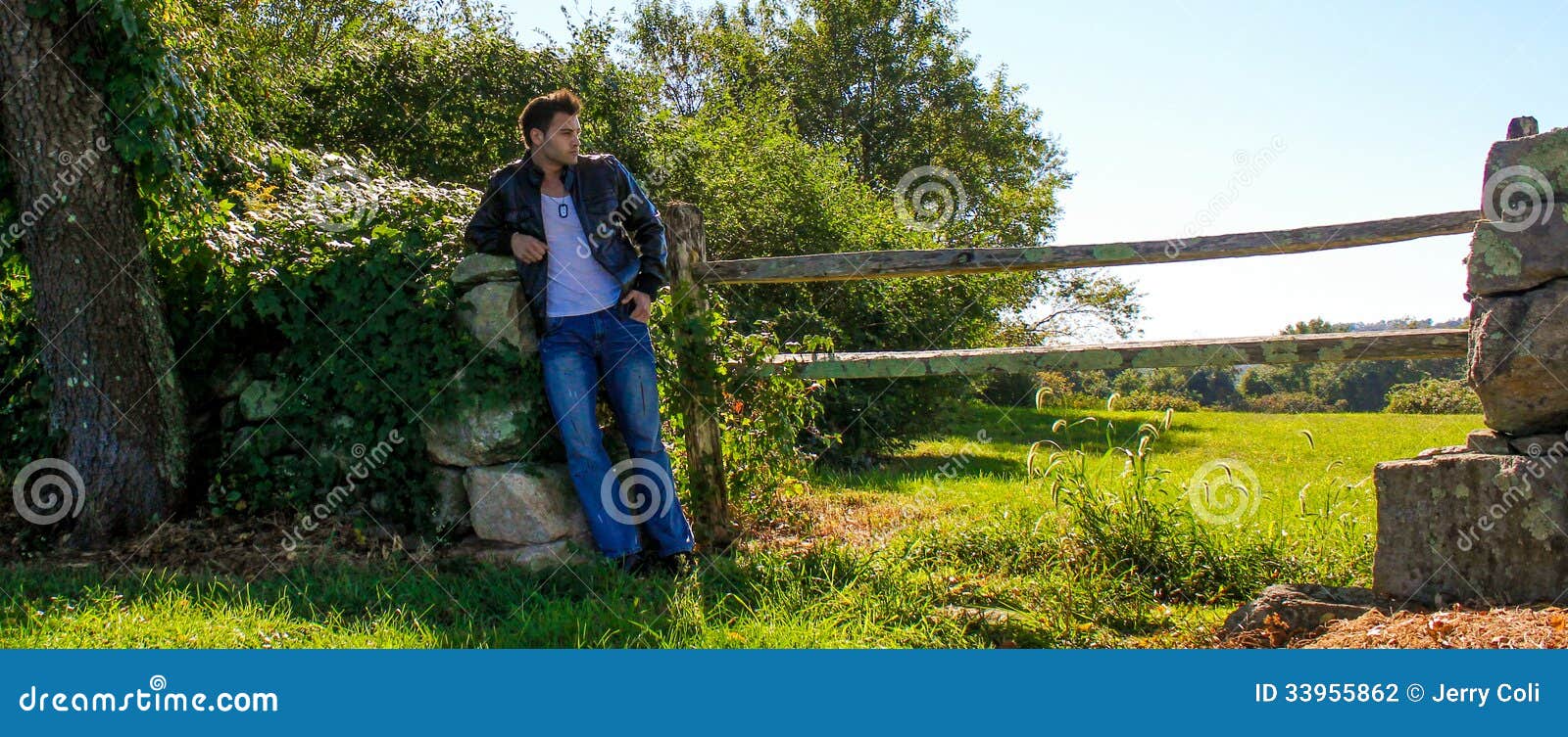Male Model Leaning on a Stone Wall. Stock Photo - Image of leaning ...