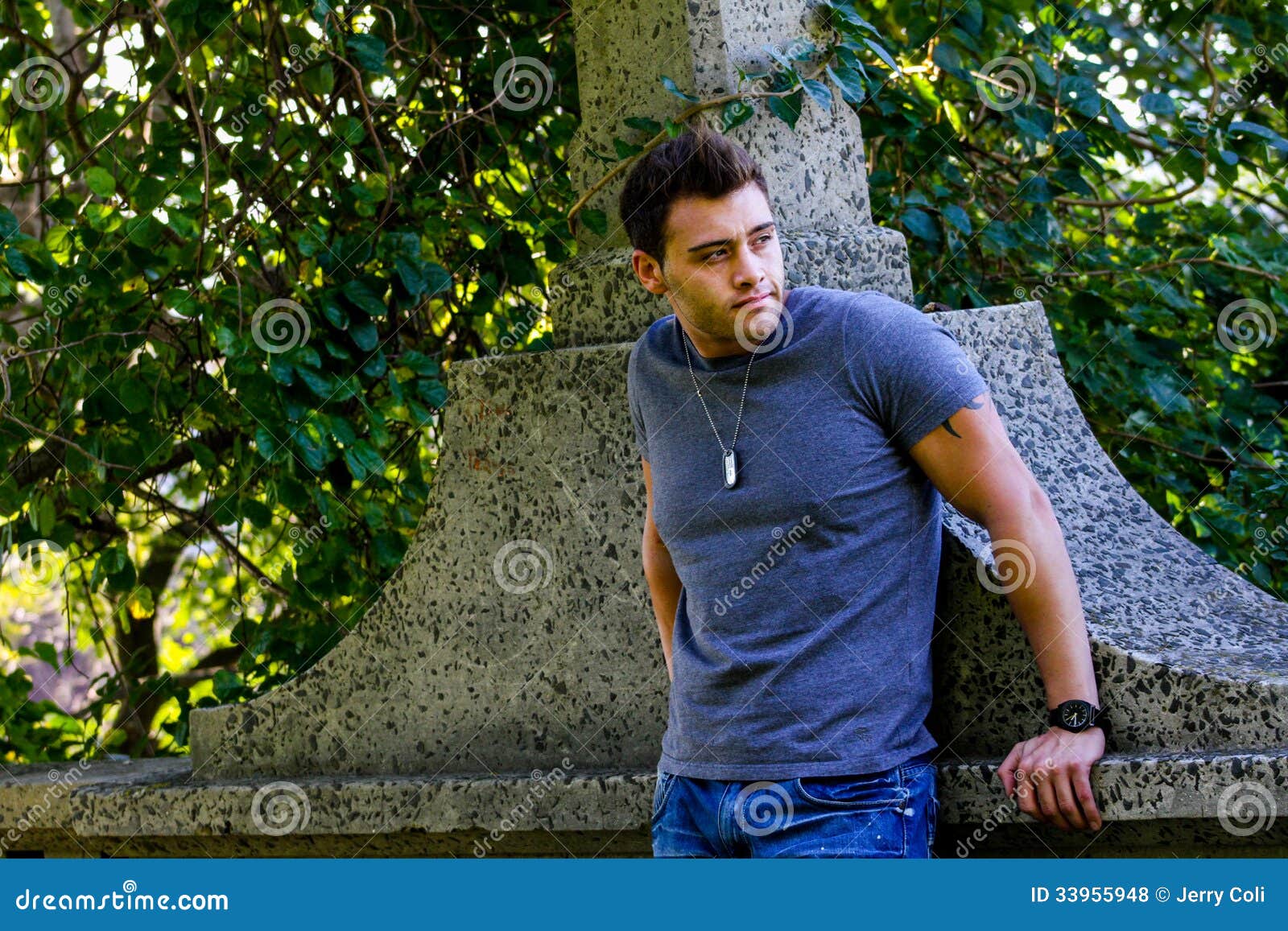 Male Model Leaning on a Stone Wall. Stock Photo - Image of wearing ...