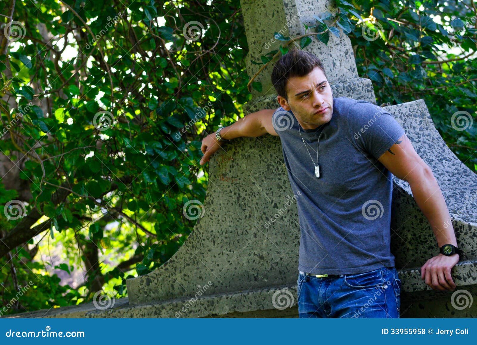 Male Model Leaning on a Stone Wall. Stock Photo - Image of leaning ...