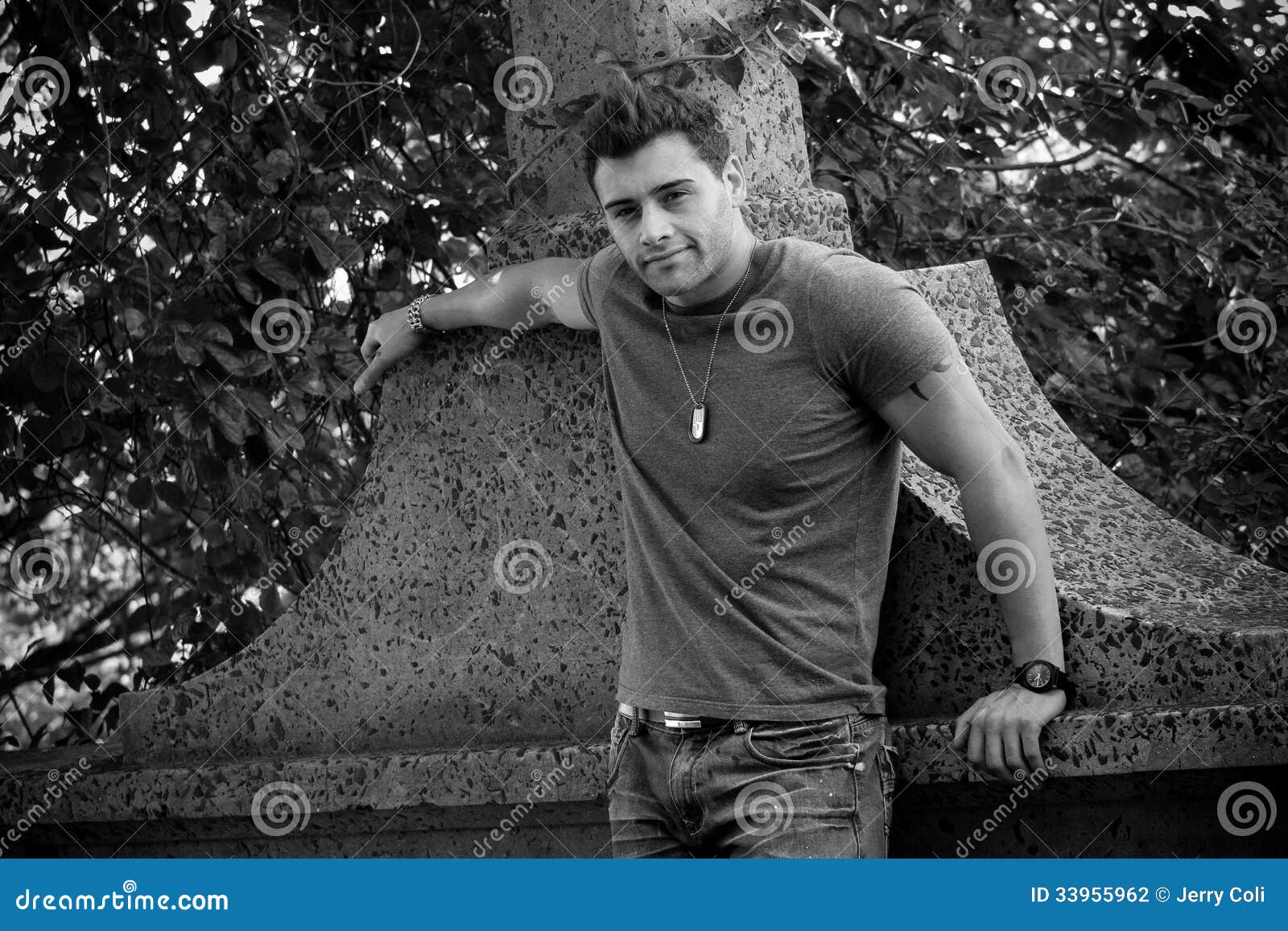 Male Model Leaning on a Stone Wall. Stock Photo - Image of leans ...