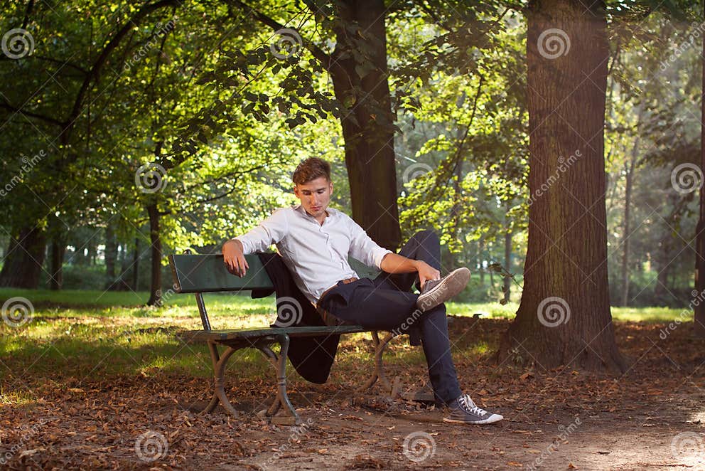 Male Model Sitting on a Bench Stock Photo - Image of adult, relaxing ...