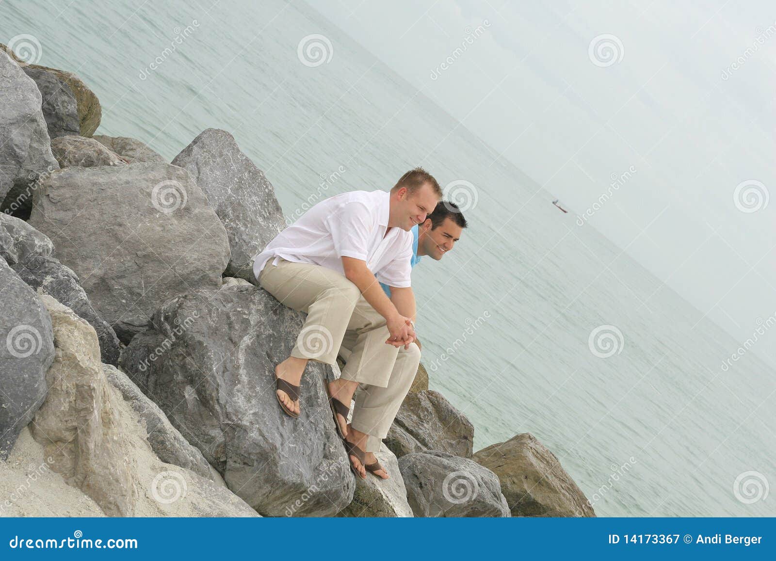 Male Models Sitting on Rocks Stock Image - Image of corporate, isolated ...