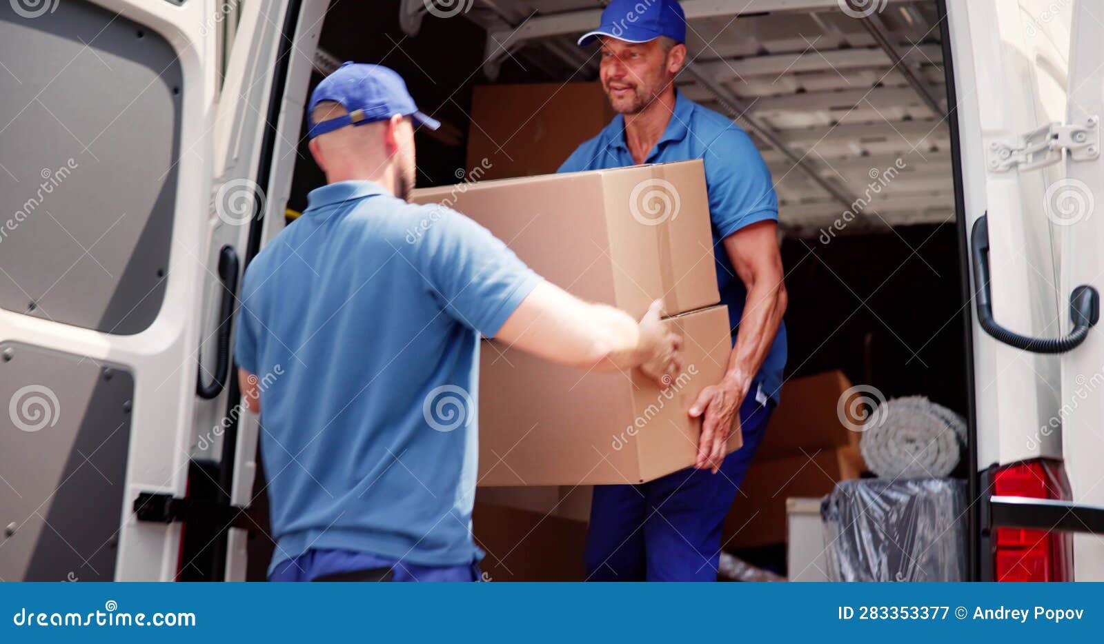 Male Movers in Uniform Loading Delivery Stock Image - Image of mover ...
