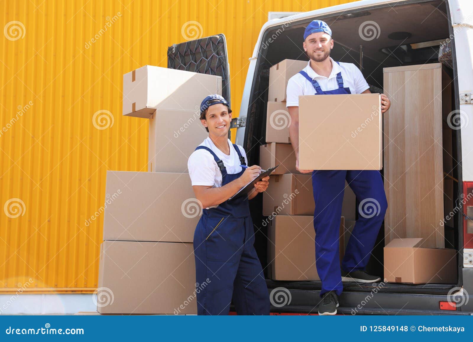 Male Movers Unloading Boxes Stock Photo - Image of mortgage, clipboard ...