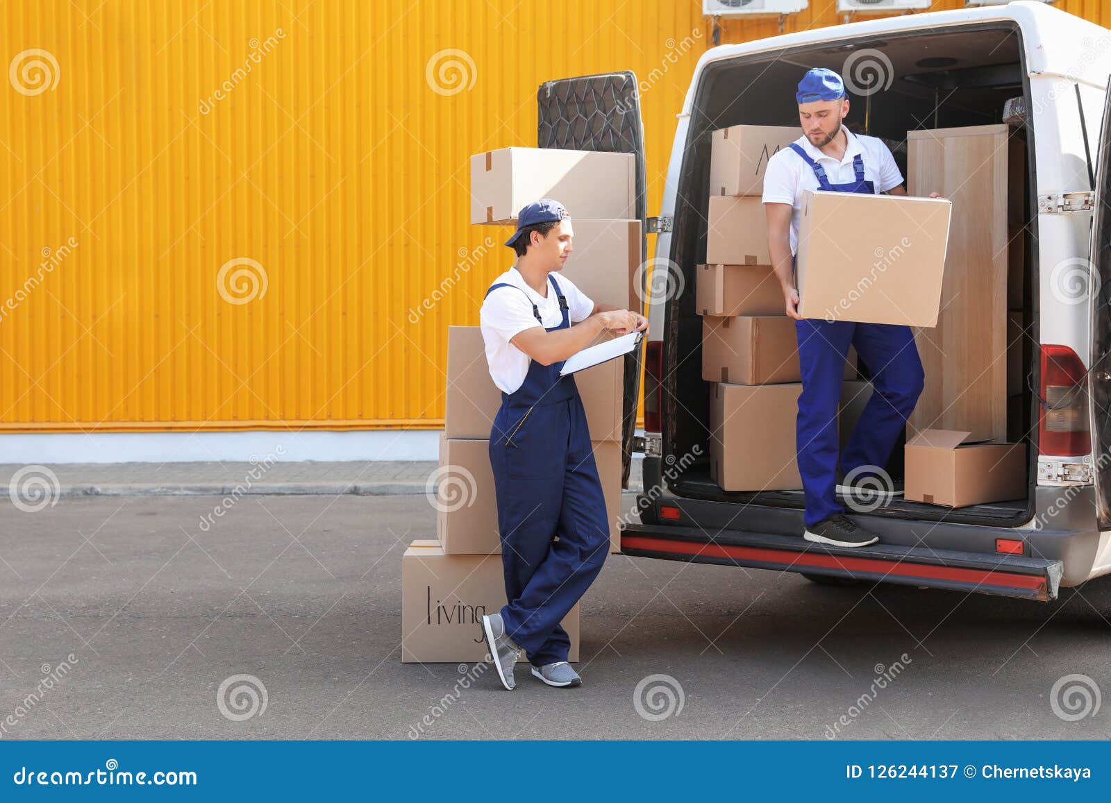 Male Movers Unloading Boxes from Van Stock Image - Image of house ...