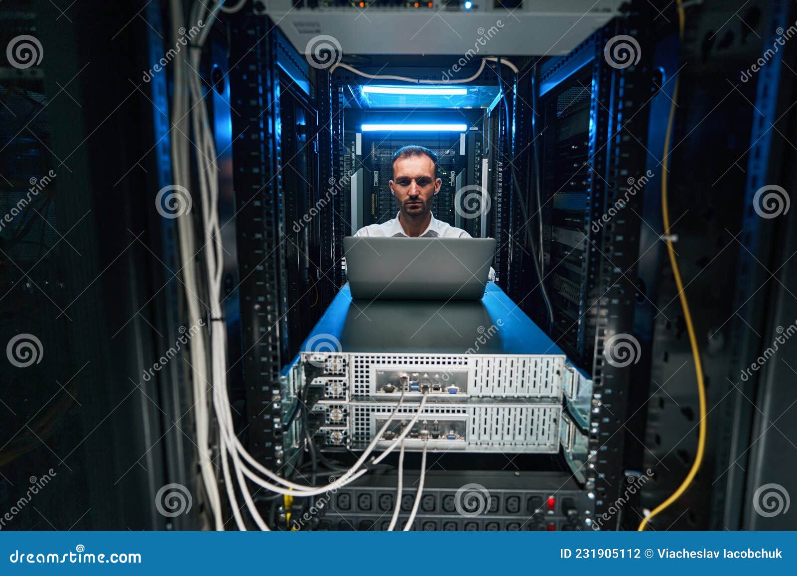 Male Network Administrator Running Software Check of Server Equioment ...