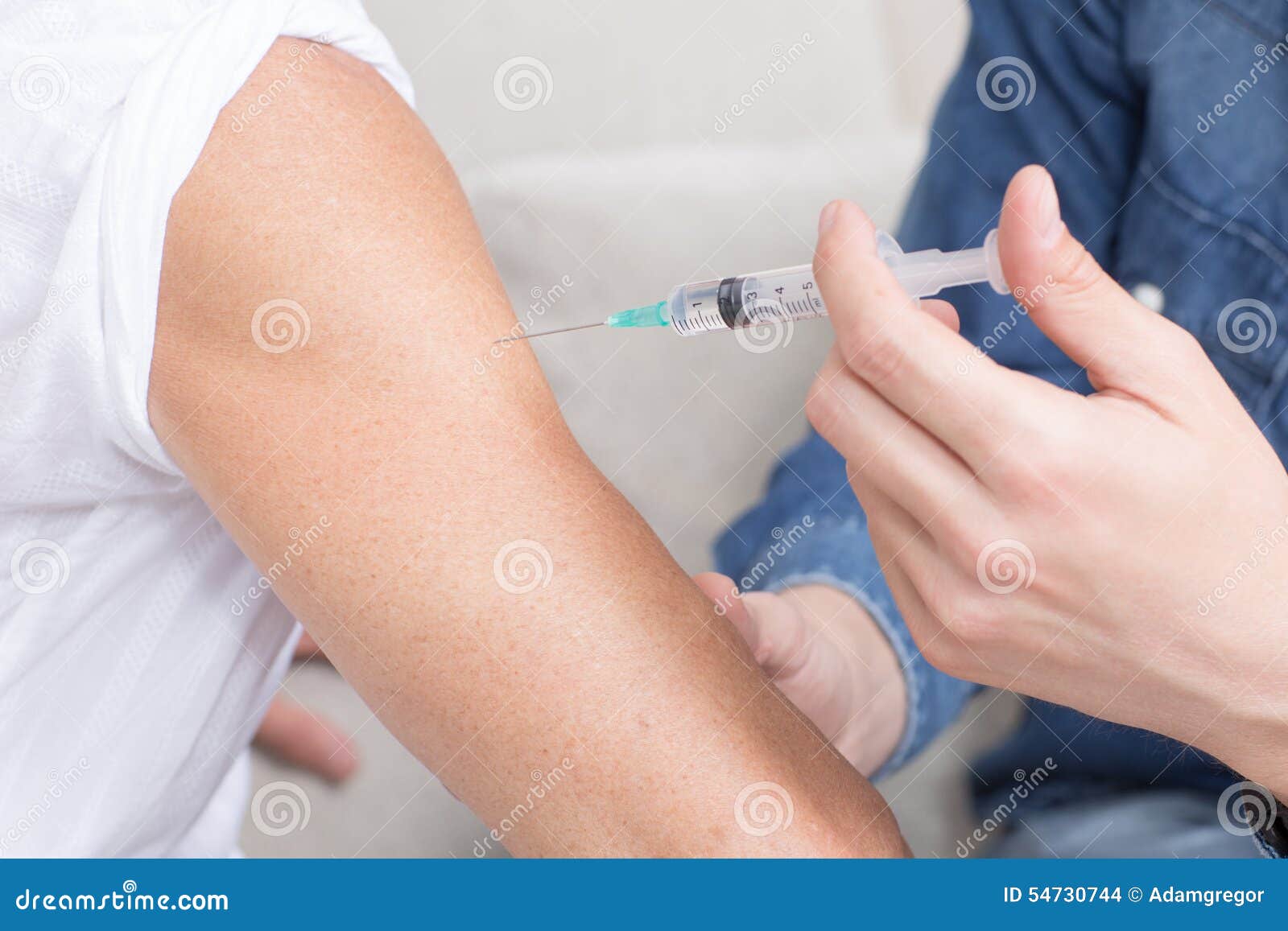 Male Nurse Setting an Injection Stock Photo - Image of booster, syringe ...
