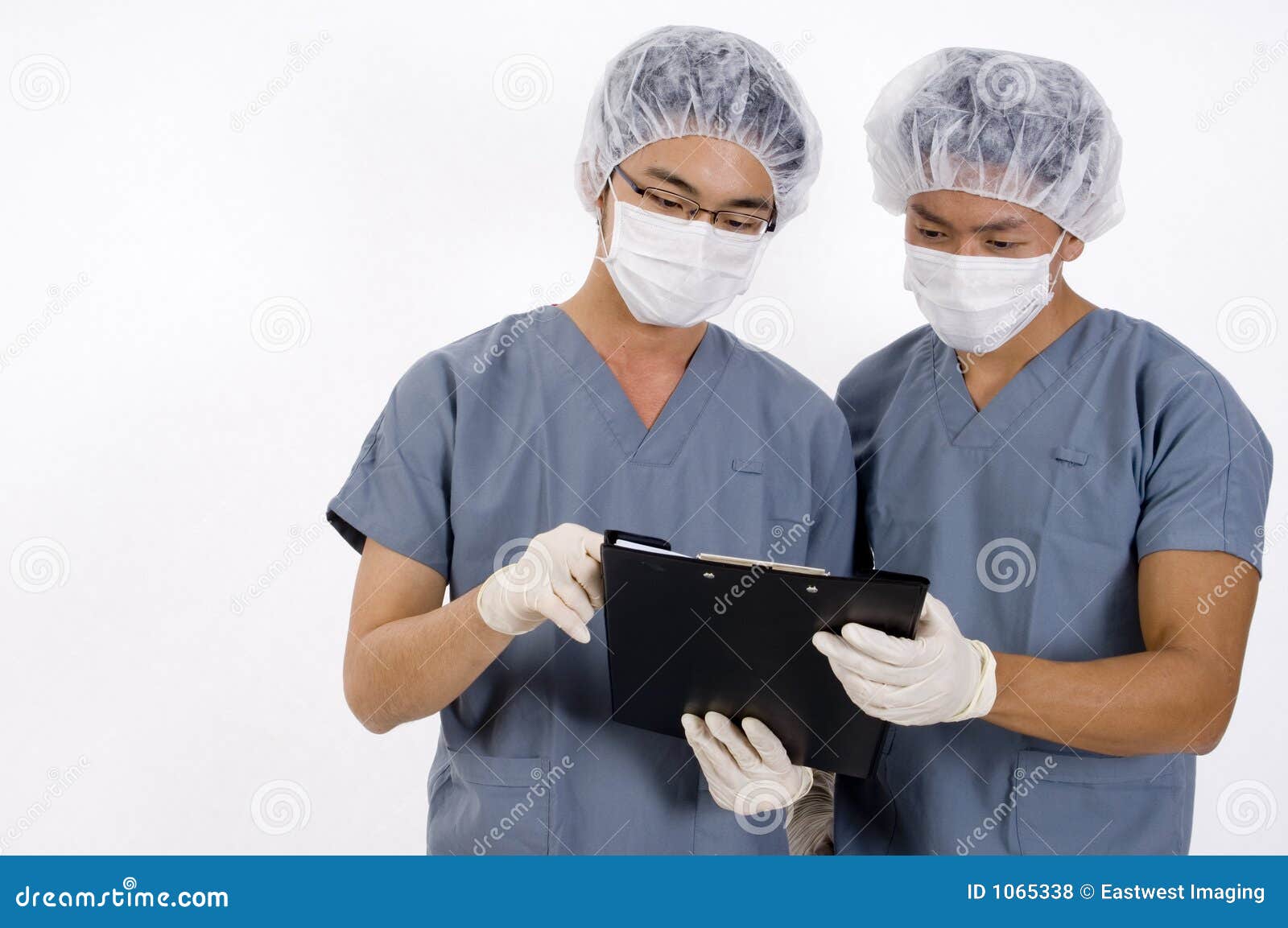 Male Nurses stock photo. Image of clipboard, read, young - 1065338