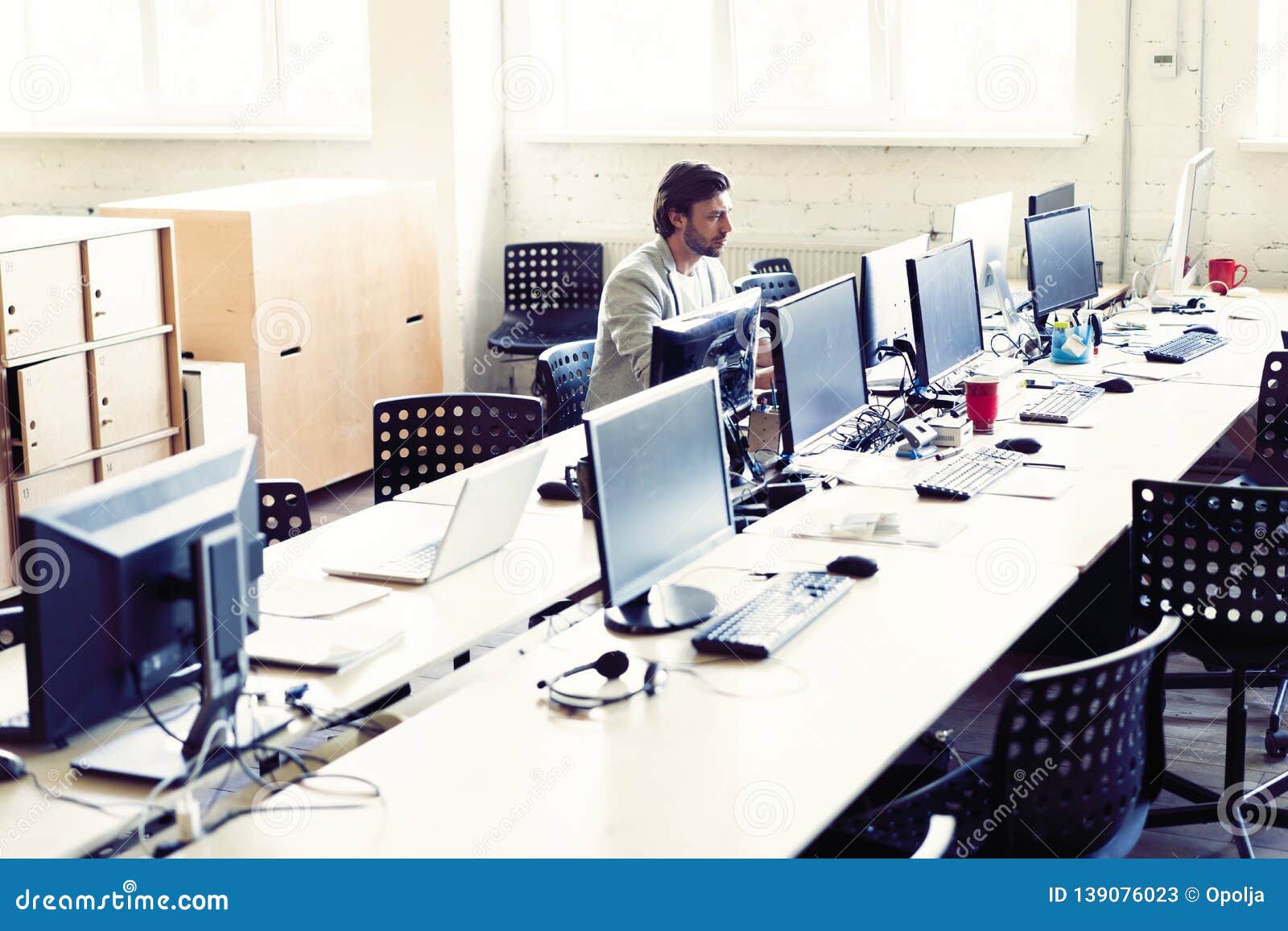 Male Office Worker Looking at Computer Screen with Data Stock Image ...
